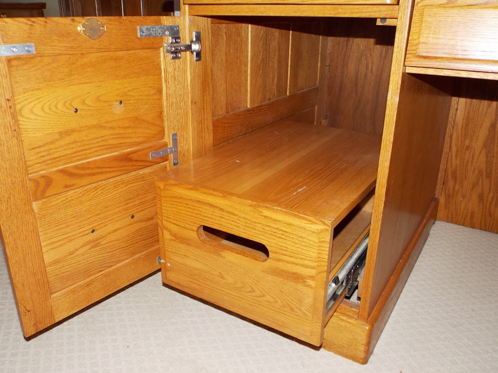 A Solid Oak Roll Top Computer Desk by "Winners Only Inc." | EBTH