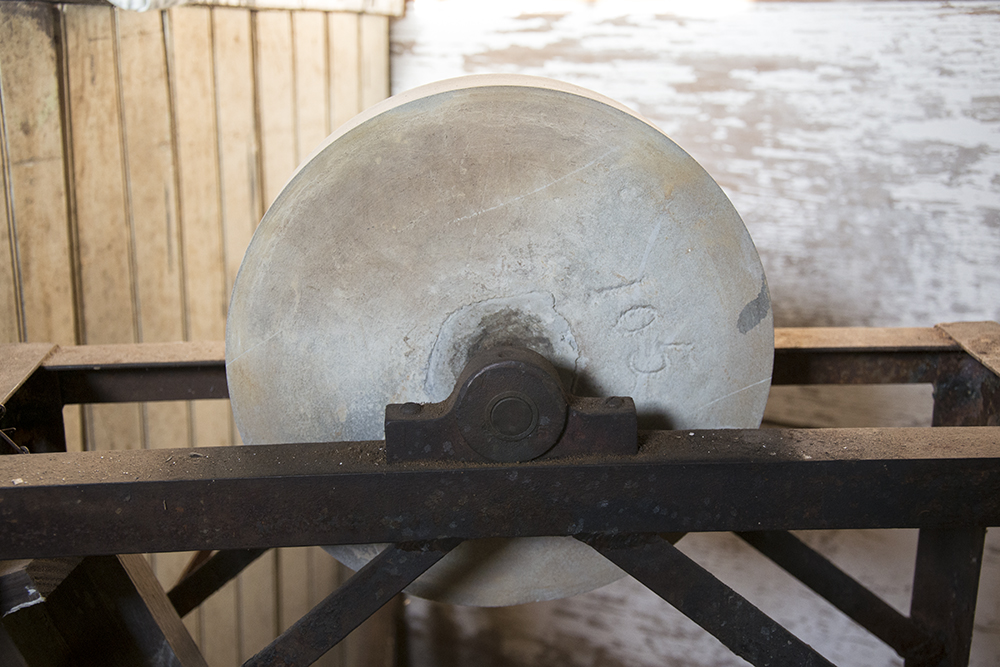 Vintage Grinding Stone on Stand | EBTH