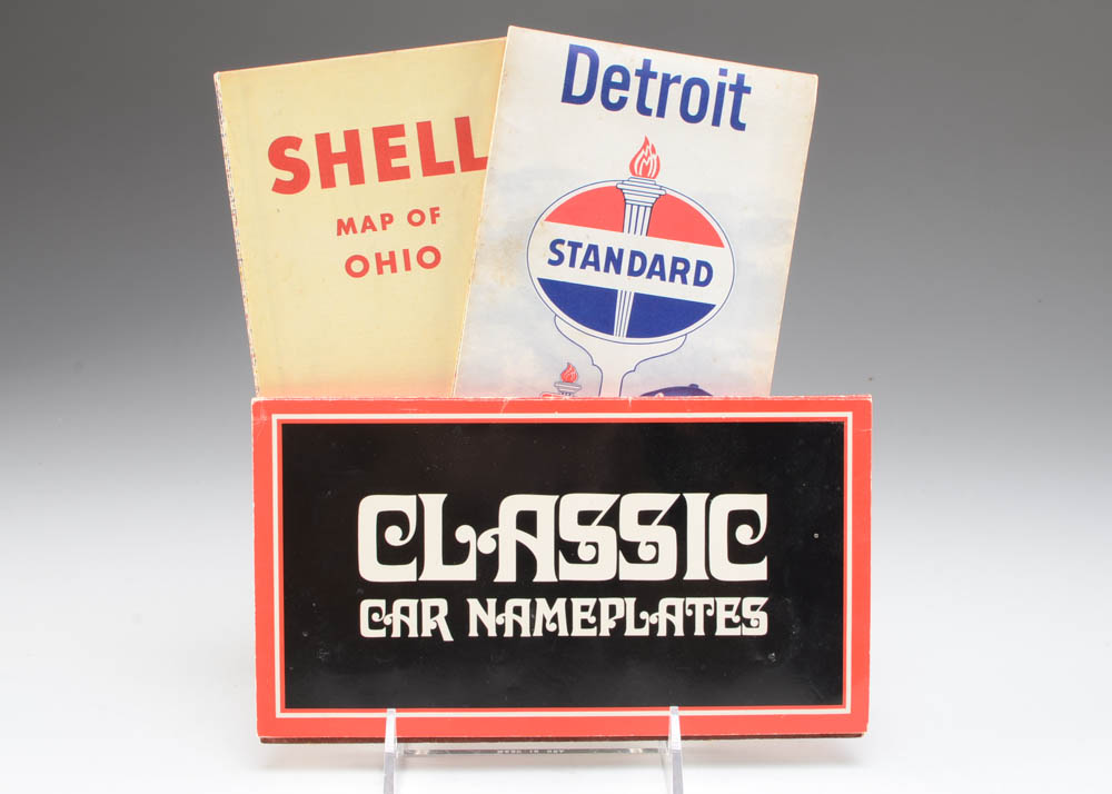 Vintage Bronze Classic Car Nameplates with Pair of Gas Station Maps | EBTH
