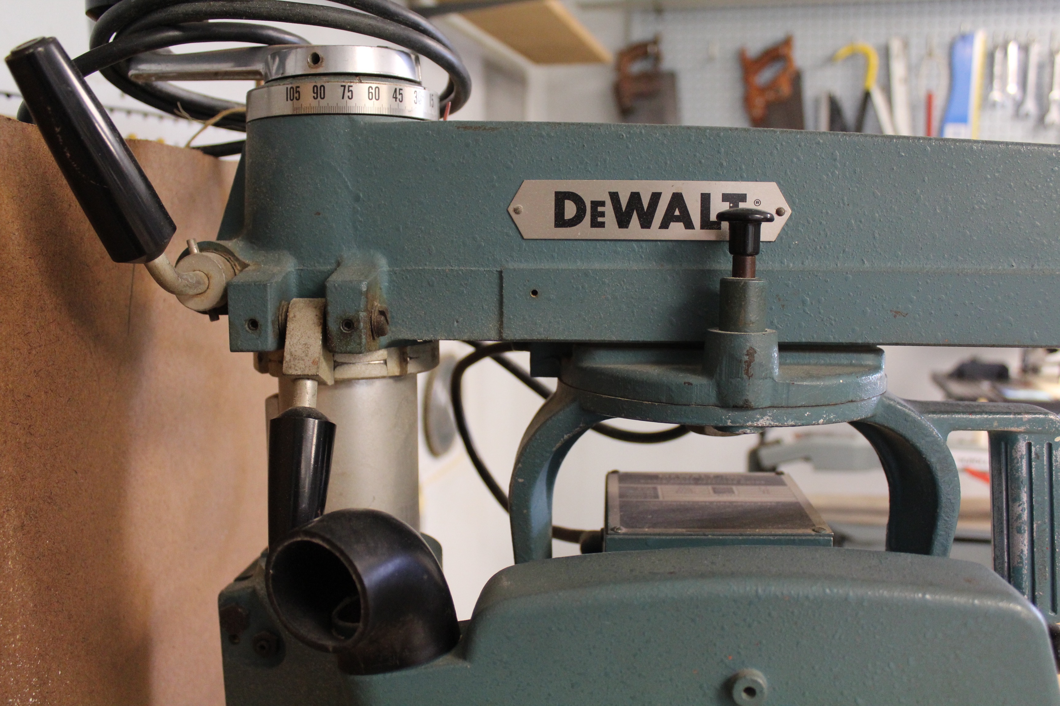 DeWalt Power Shop Radial Arm Saw on Stand and Wall of Blades | EBTH