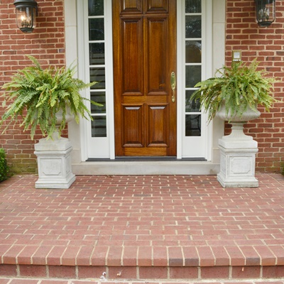 Pair of Cast Stone Planters On Decorative Cast Stone Bases | EBTH