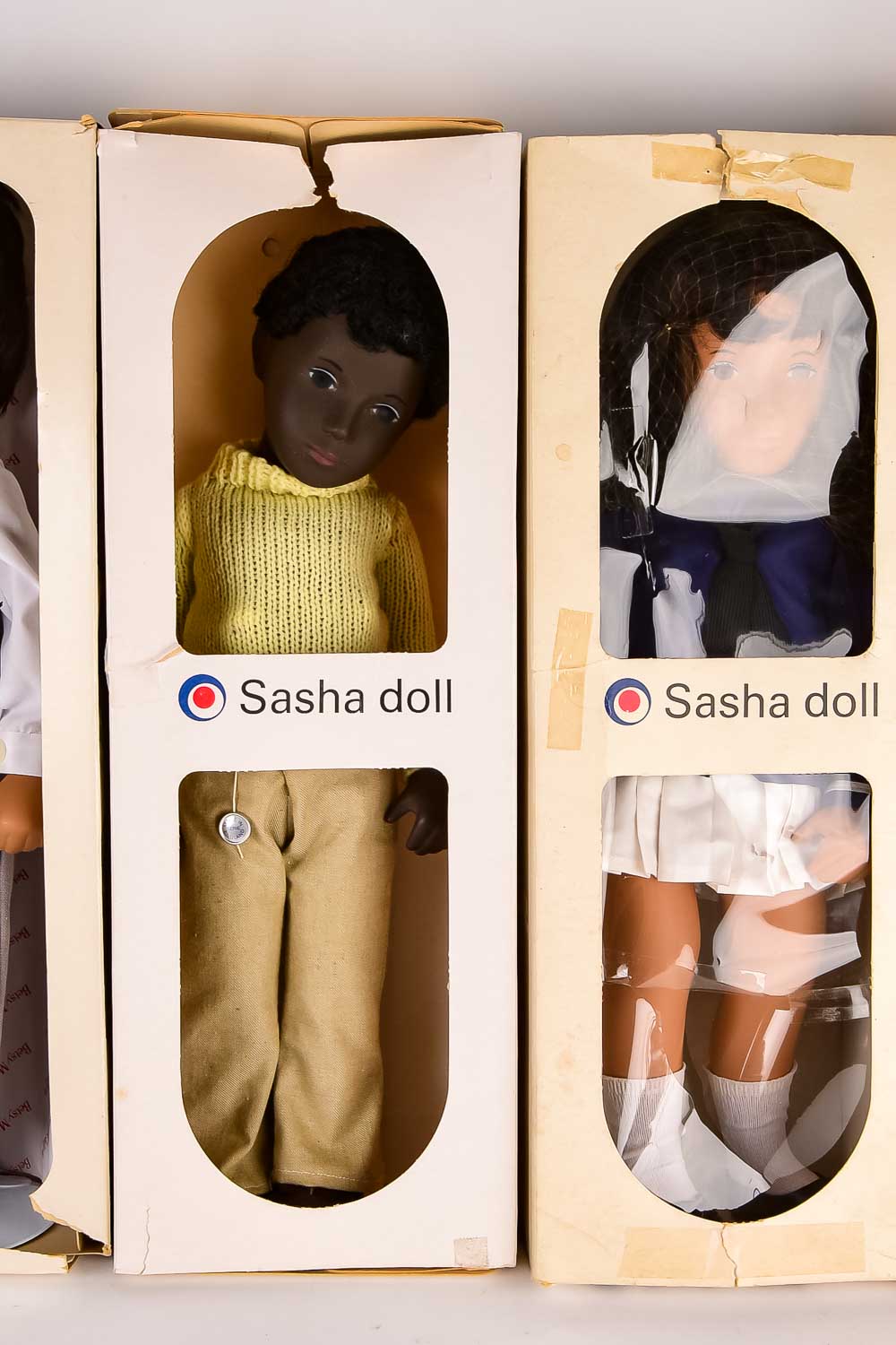 Collection of Eight "Sasha" Dolls, with Doll Trunk and Clothing | EBTH