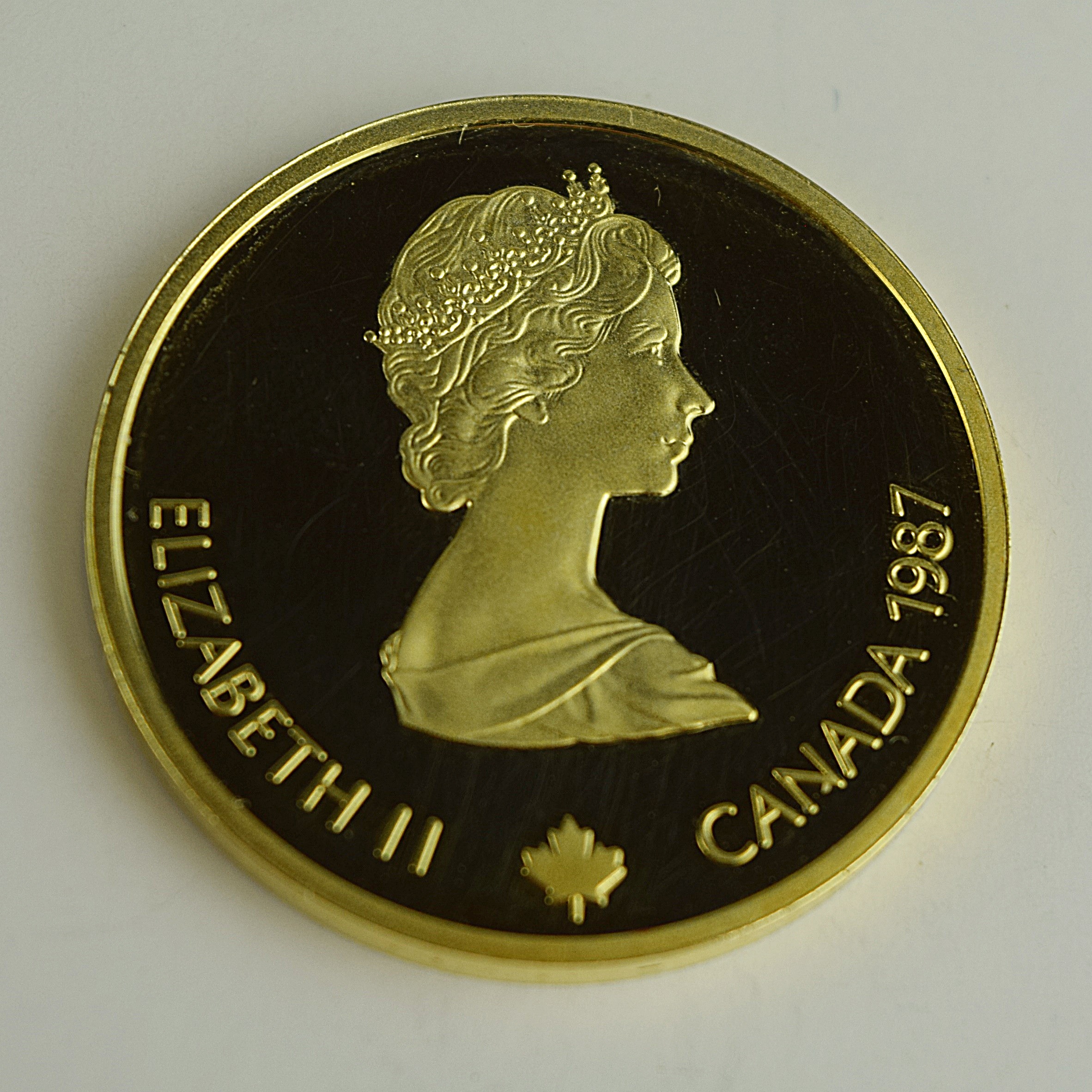 Royal Canadian Mint 1988 Calgary Olympics $100.00 14K Gold Coin | EBTH