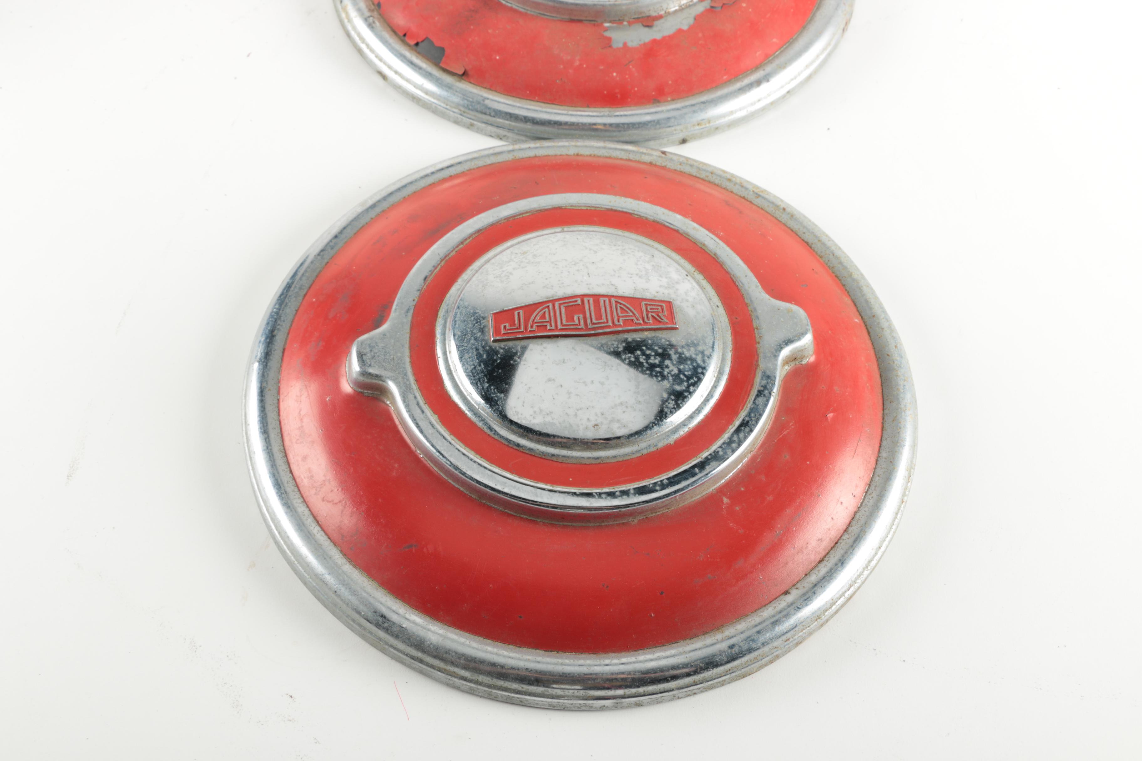 Two Red Vintage Jaguar Hubcaps | EBTH