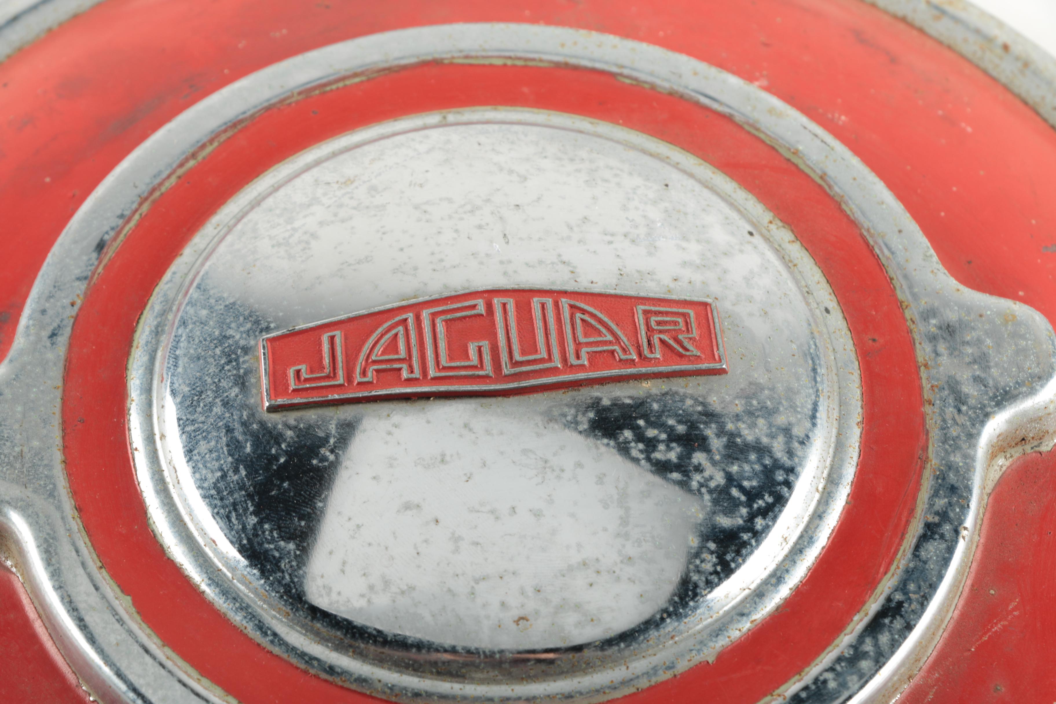 Two Red Vintage Jaguar Hubcaps | EBTH
