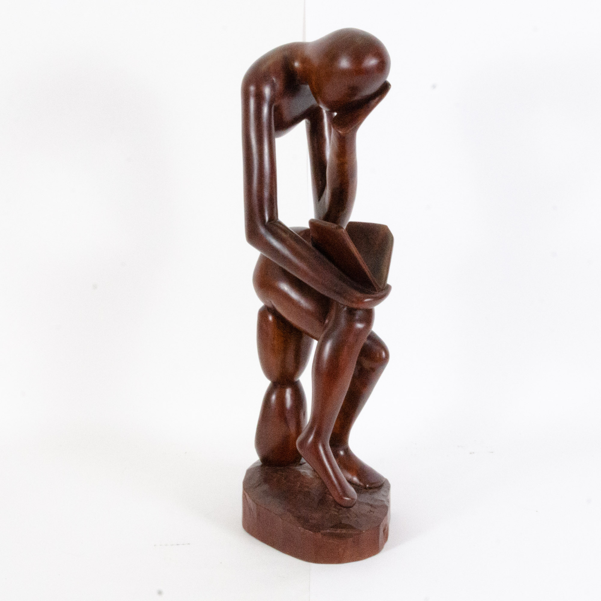 Figural Wooden Sculpture of Man Reading | EBTH