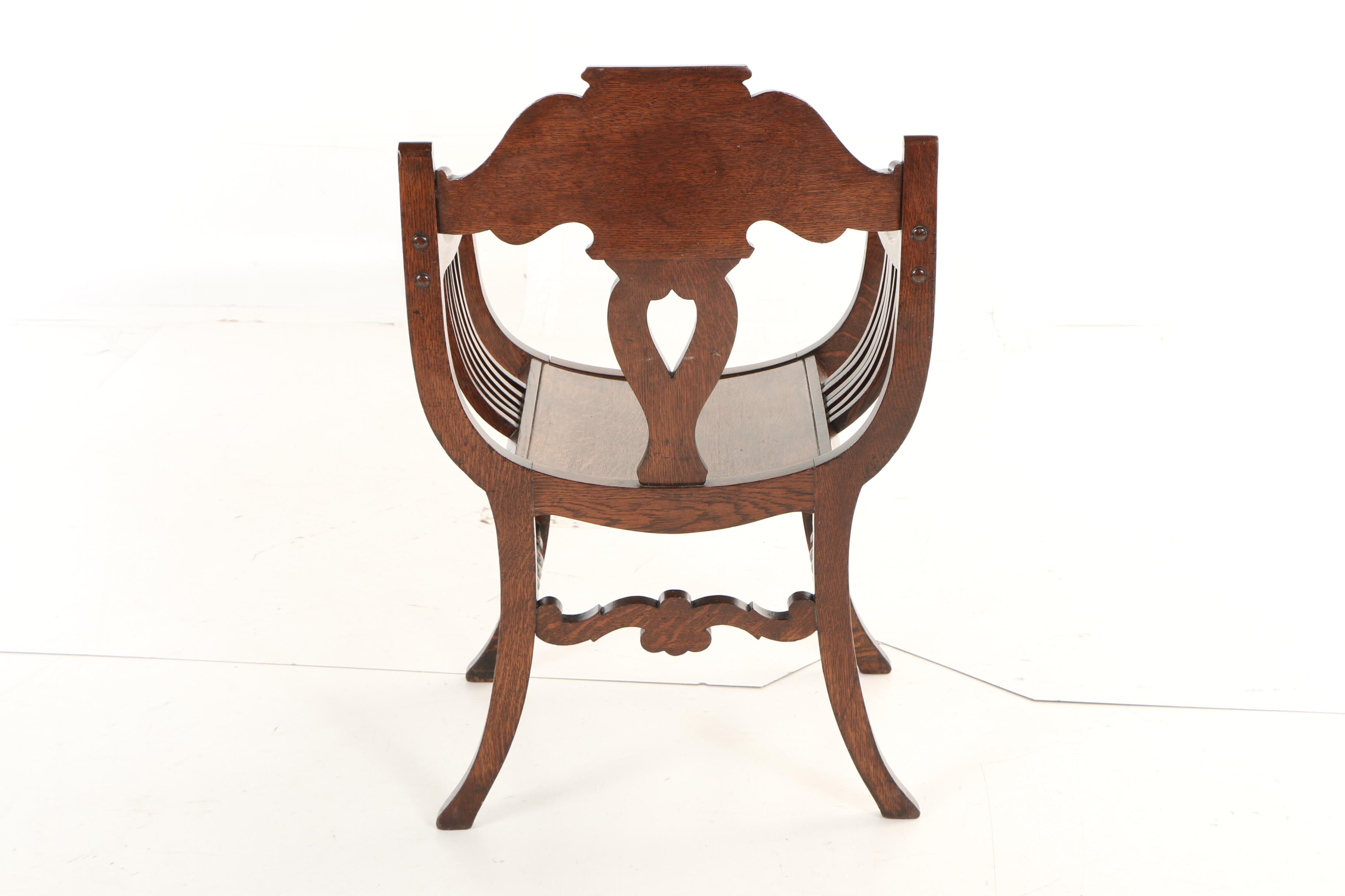 The Stomps Burkhardt Co., Late Victorian Carved Oak Savonarola Chair | EBTH