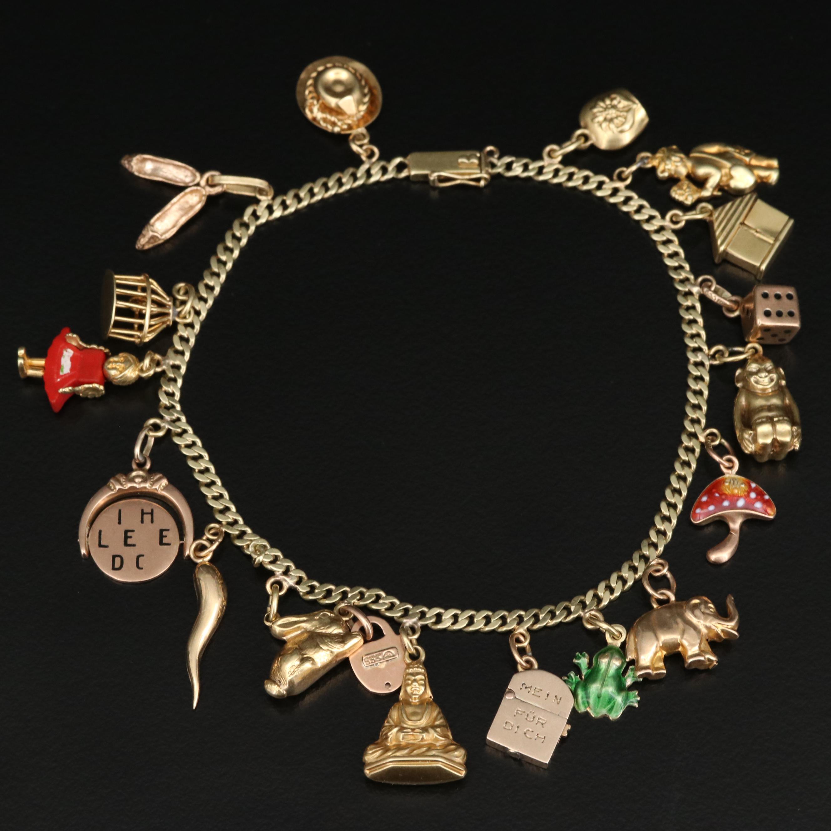 Vintage 14K Charm Bracelet with Articulated and German Themed Charms | EBTH