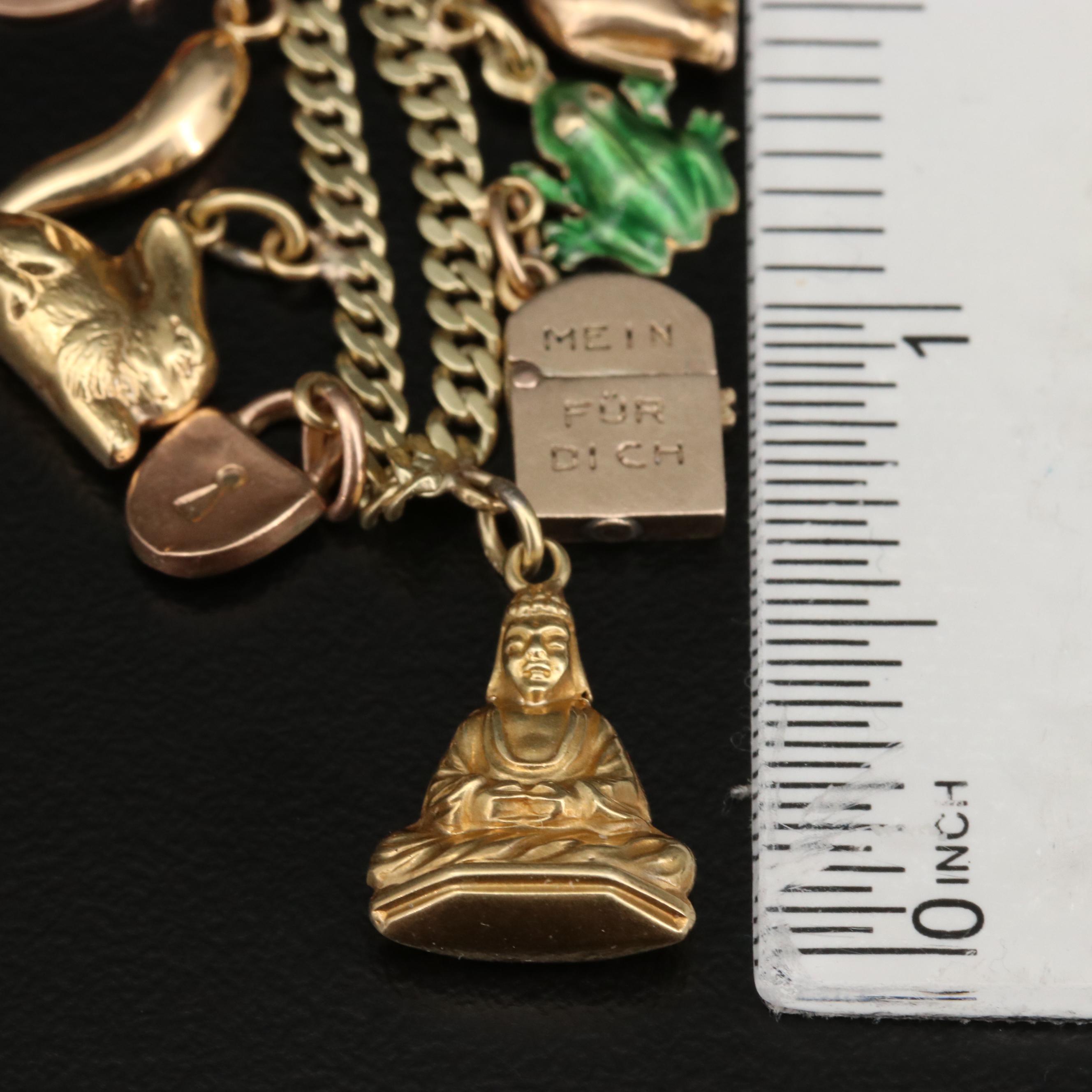 Vintage 14K Charm Bracelet with Articulated and German Themed Charms | EBTH
