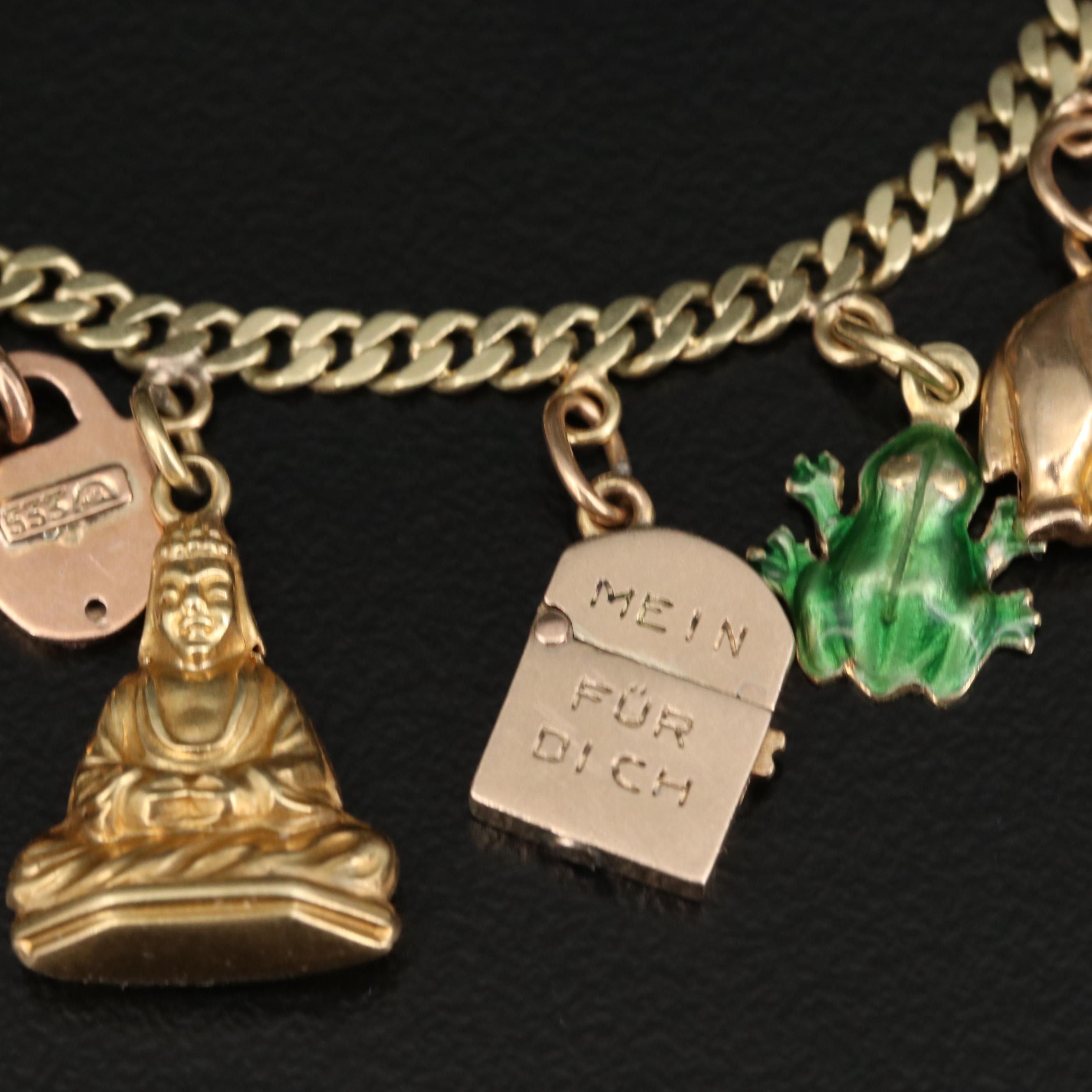 Vintage 14K Charm Bracelet with Articulated and German Themed Charms | EBTH
