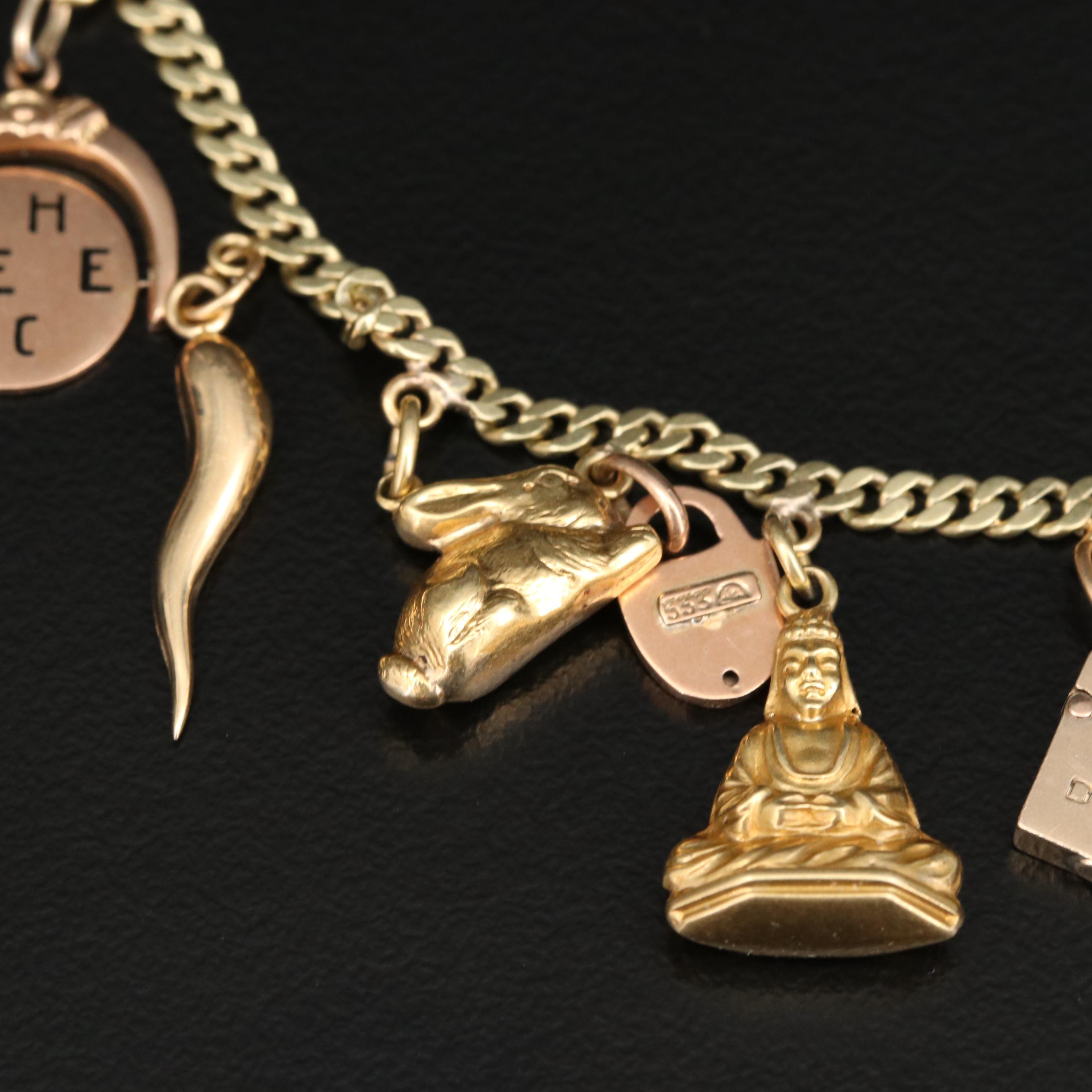 Vintage 14K Charm Bracelet with Articulated and German Themed Charms | EBTH