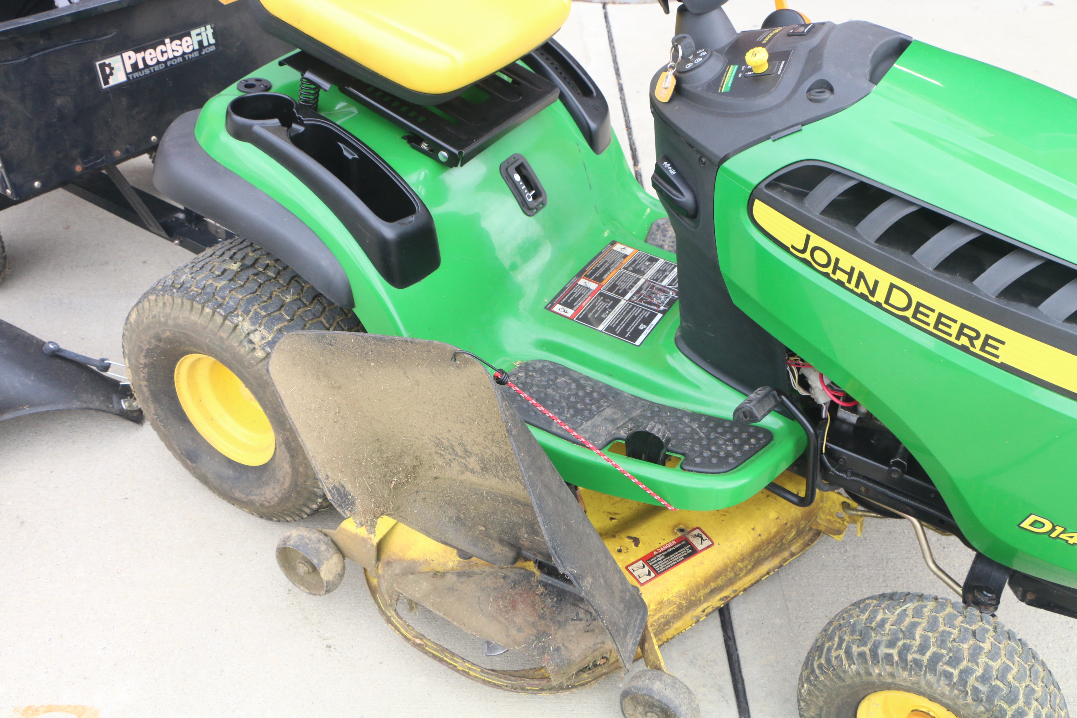 John Deere D140 Lawn Tractor with Tow Behind, Baggers and Side Vacuum Hose | EBTH