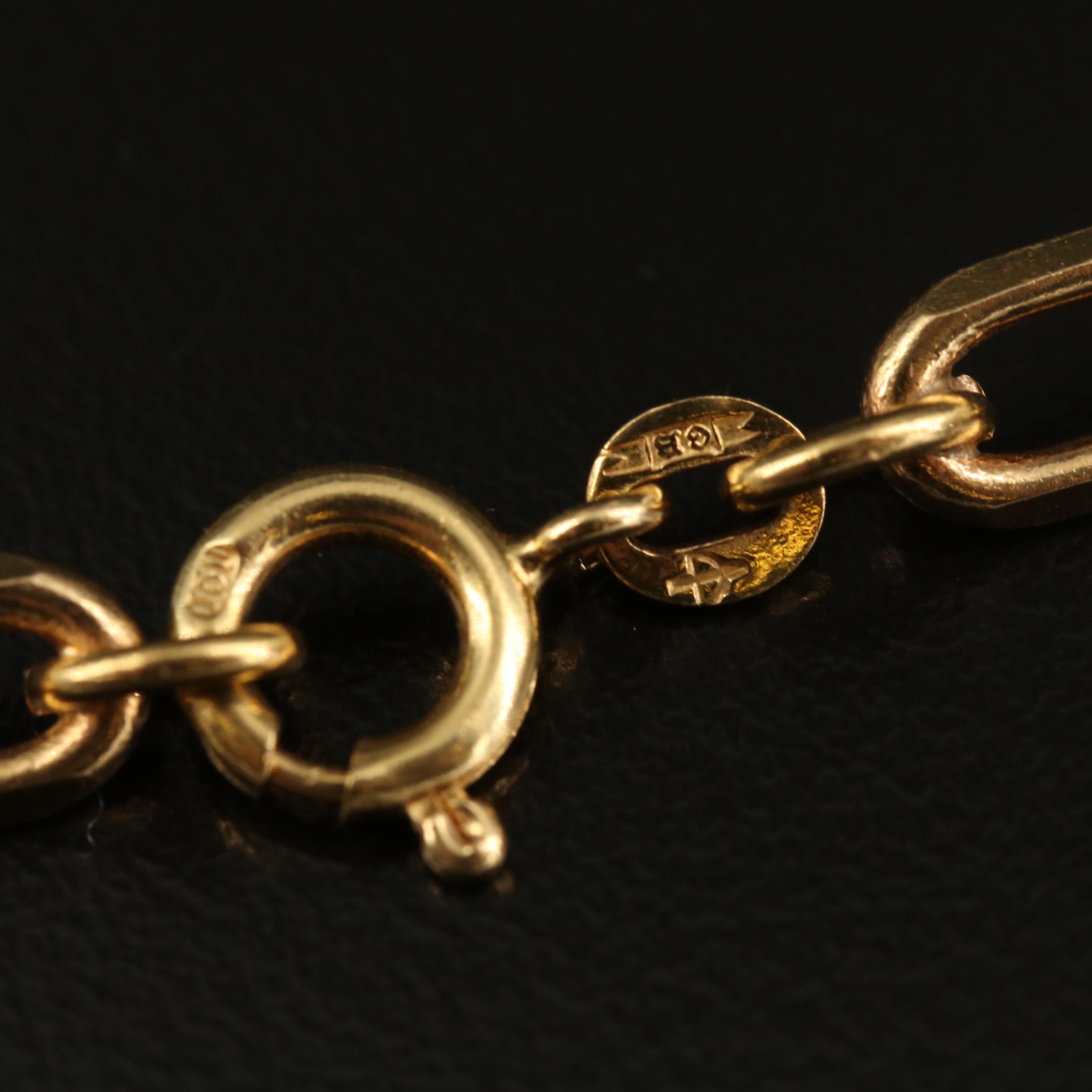 Greek 18K Emerald and Ruby Cercelée Cross Necklace | EBTH