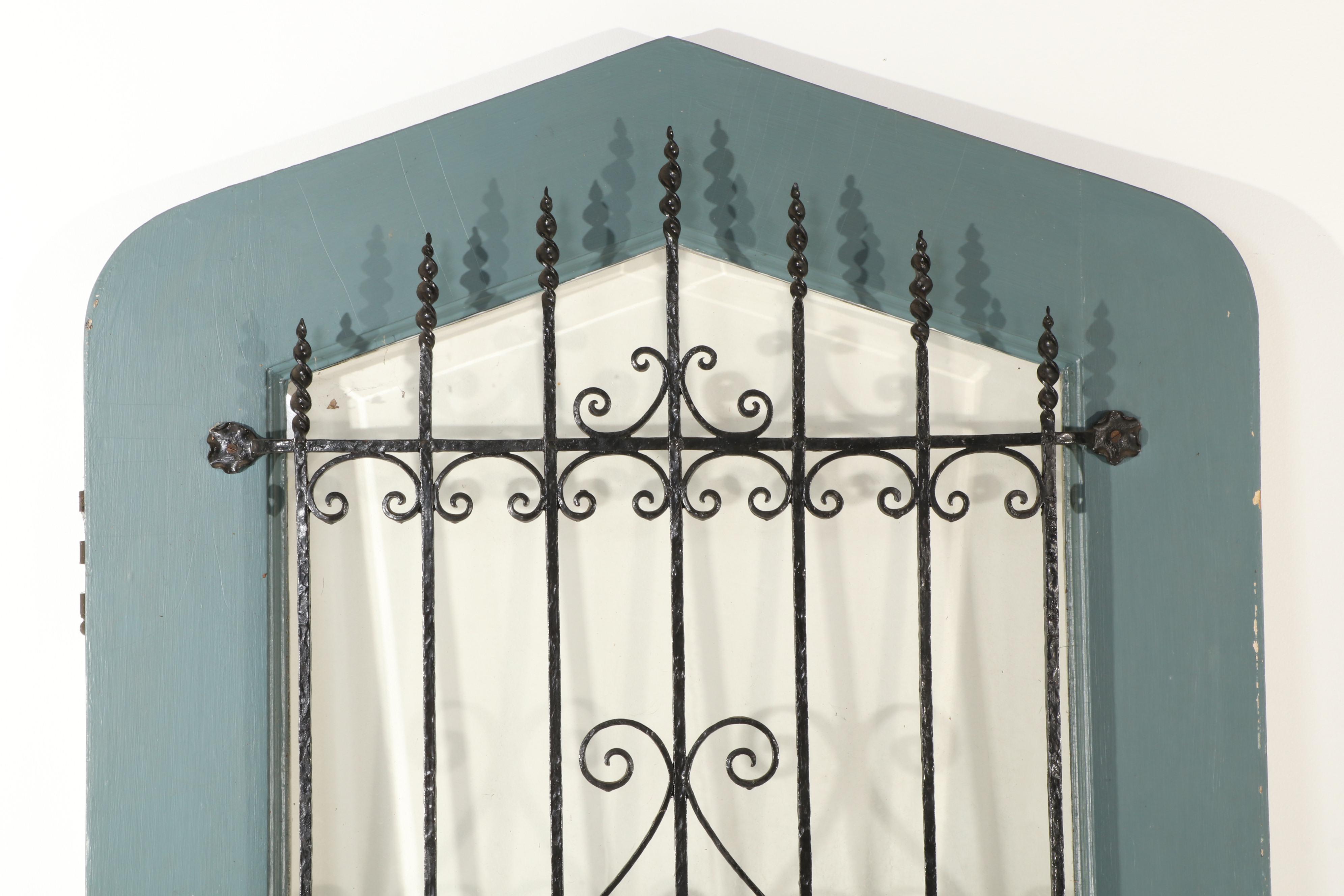 Gothic-Arched Exterior Door with Wrought Iron Grill and Beveled Glass ...