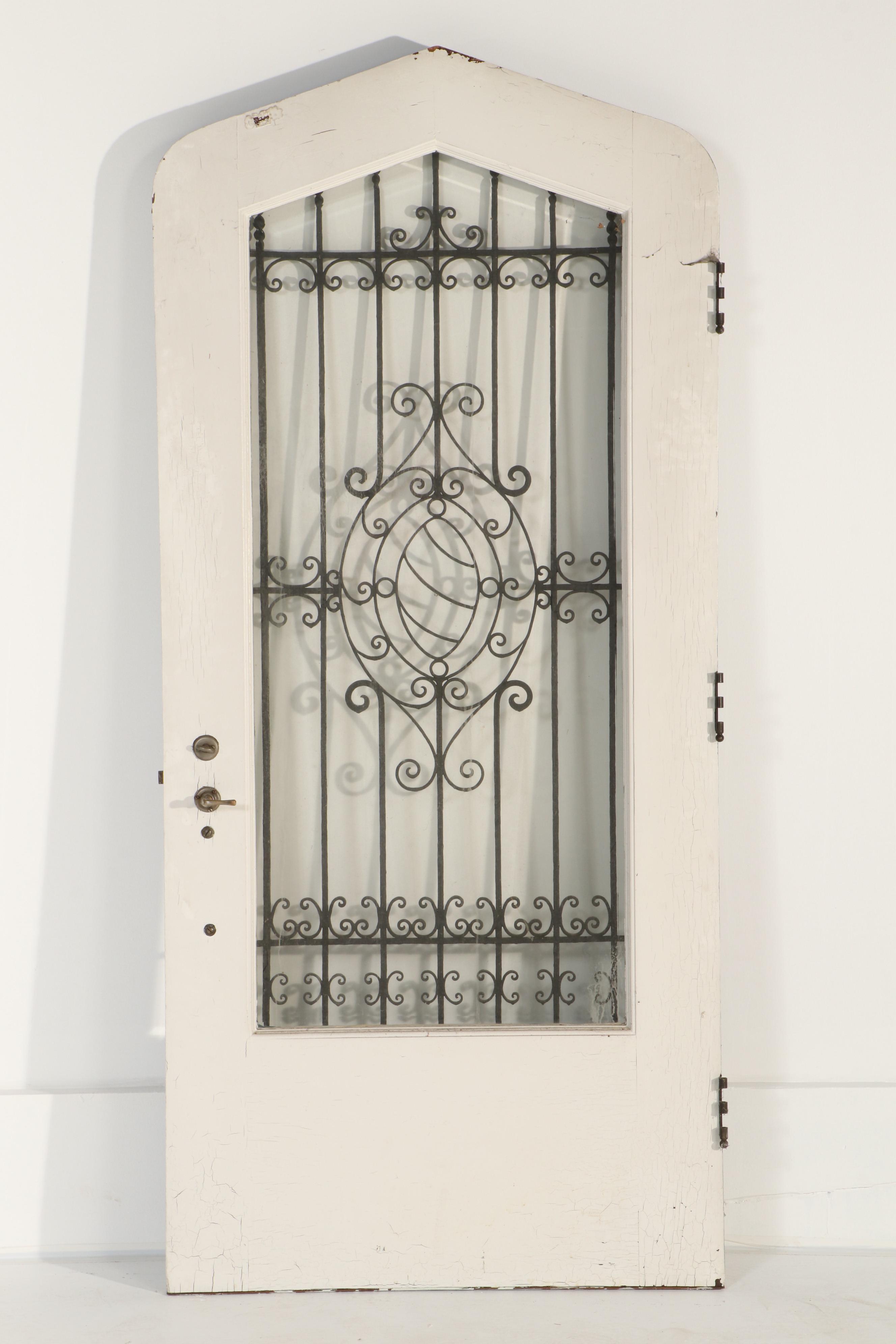 Gothic-Arched Exterior Door with Wrought Iron Grill and Beveled Glass ...