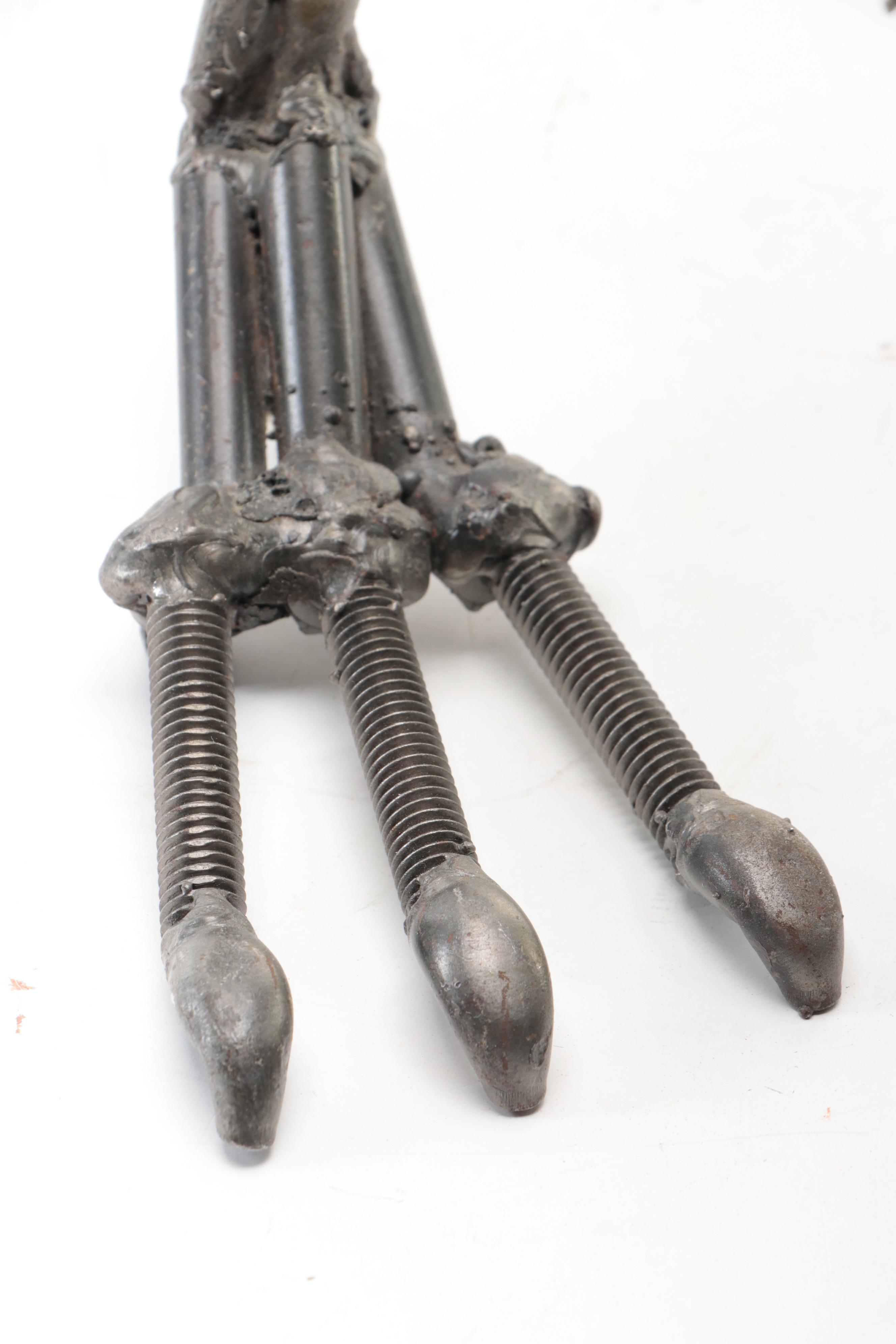 Metal Park Scrap Metal Sculpture of Predatory Dinosaur Skeleton | EBTH