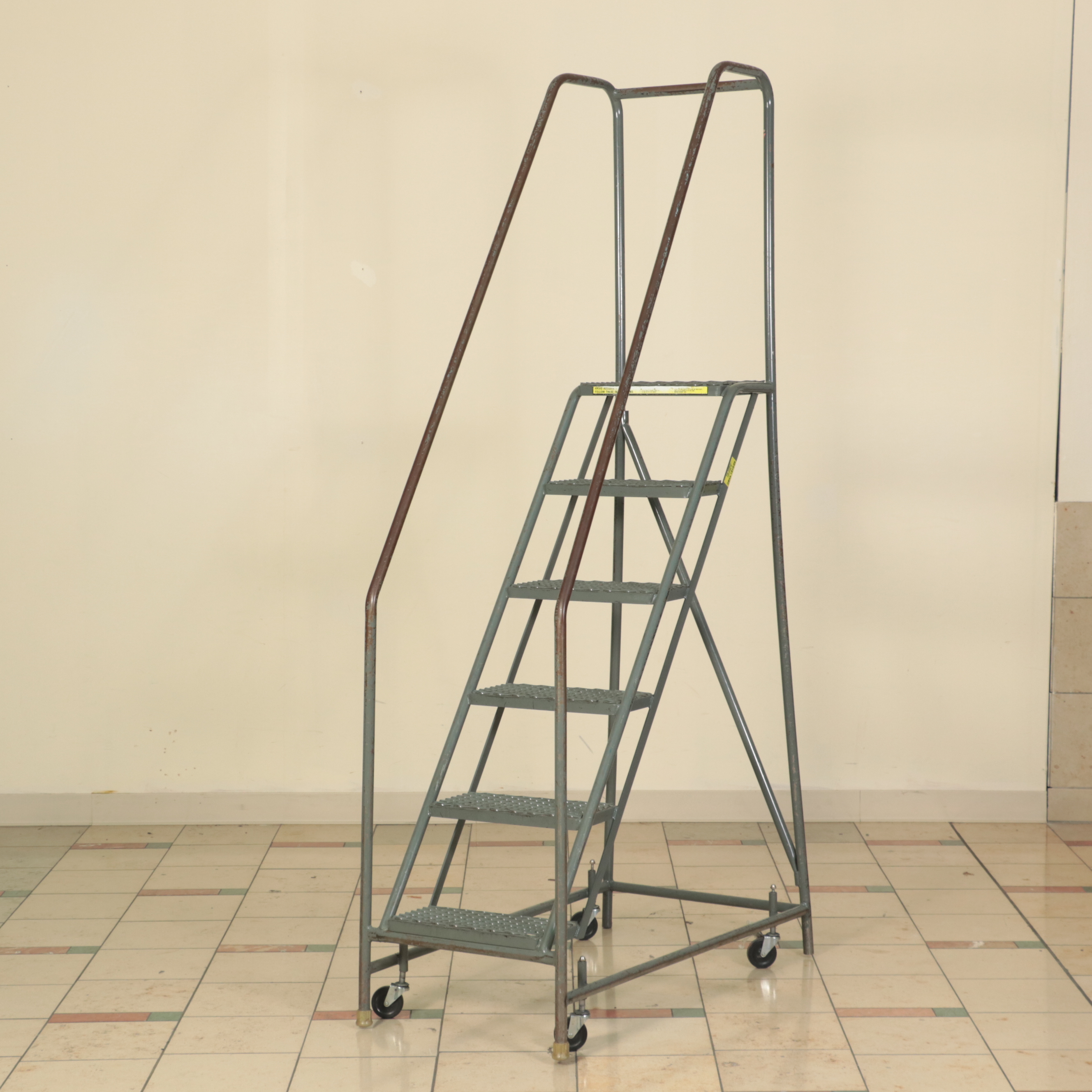Pair of Tri-Arc Metal Rolling Ladders in Gray Finish | EBTH