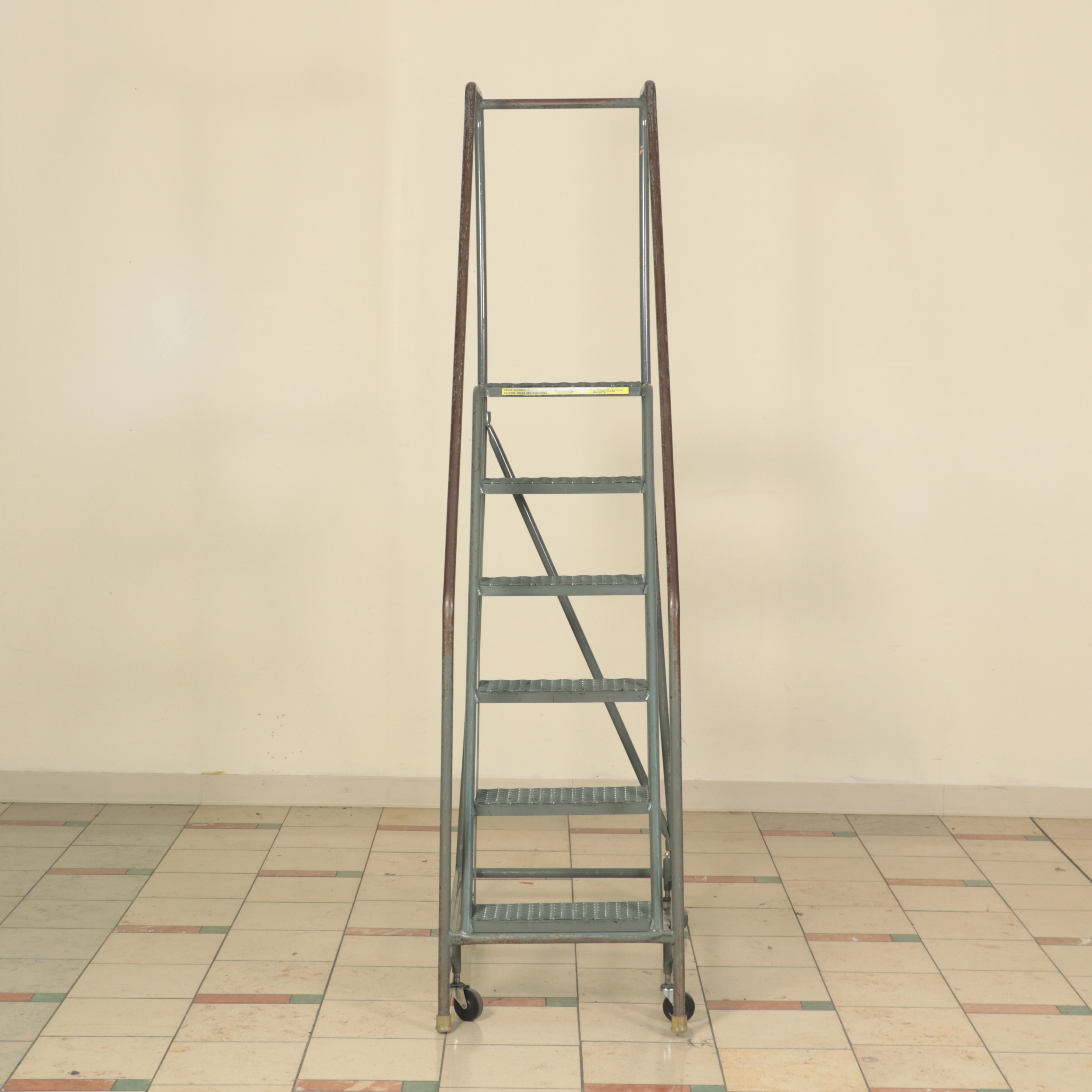 Pair of Tri-Arc Metal Rolling Ladders in Gray Finish | EBTH