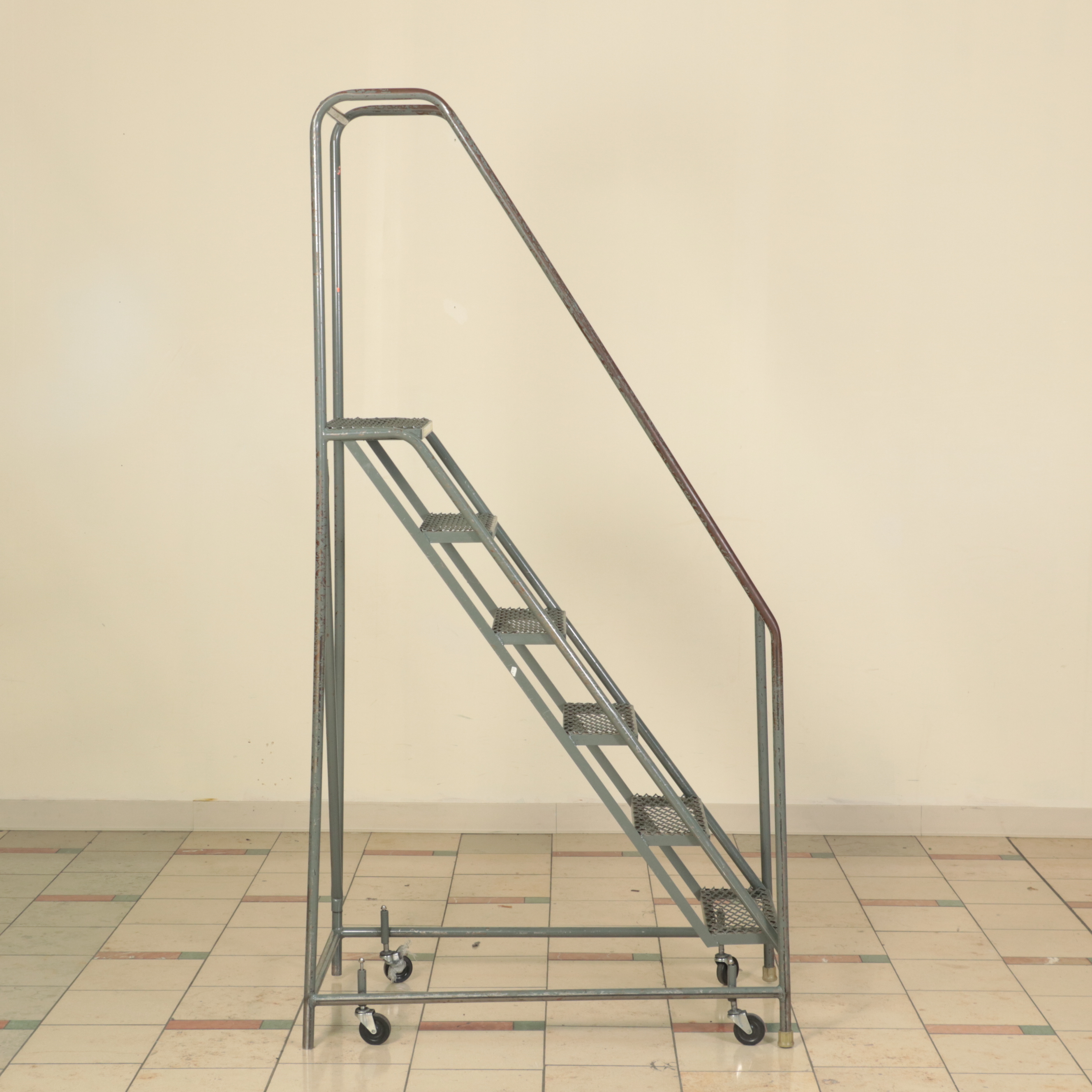 Pair of Tri-Arc Metal Rolling Ladders in Gray Finish | EBTH