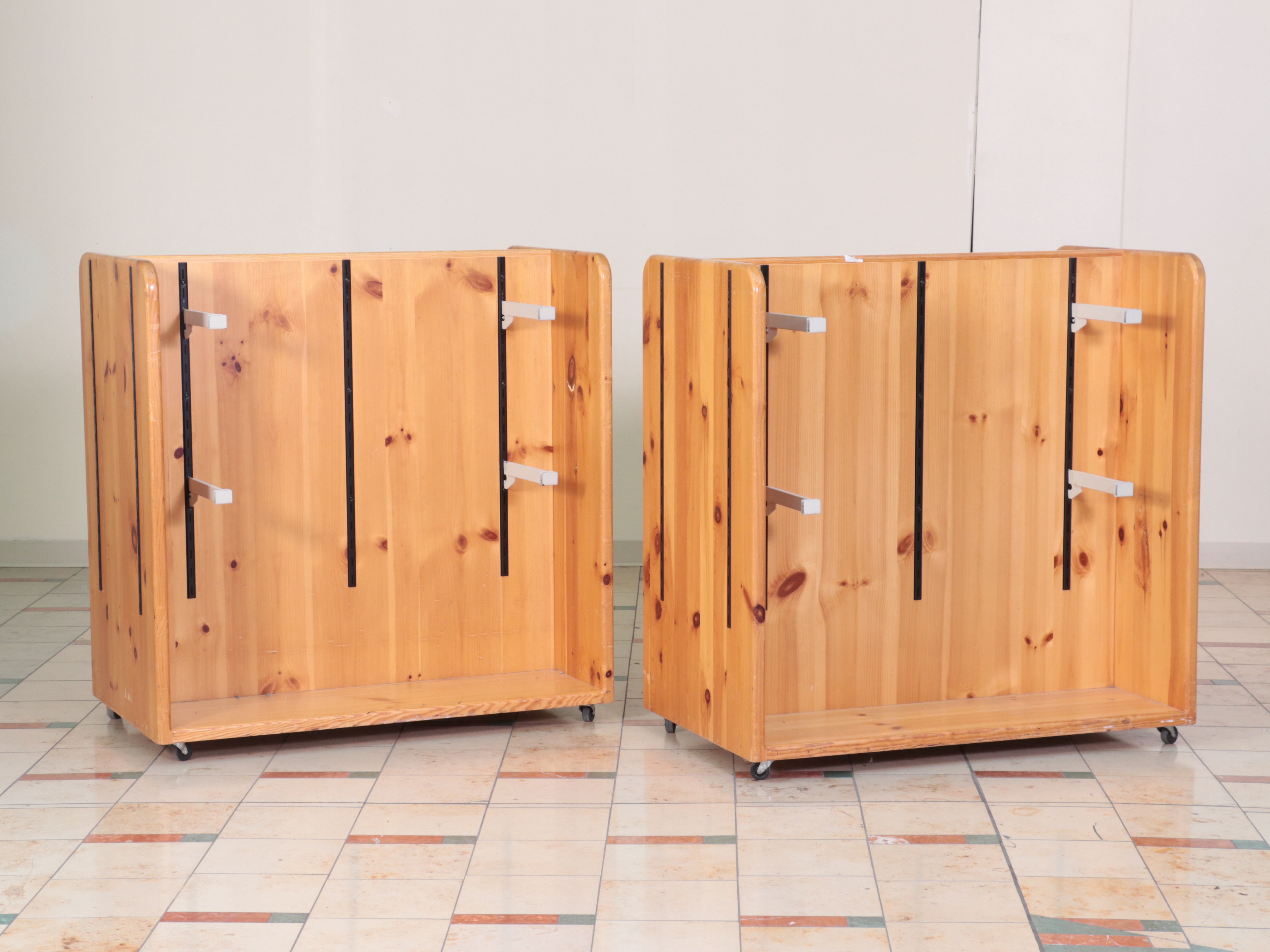 Pair of Paneled Pine Rolling Clothing Display Racks | EBTH
