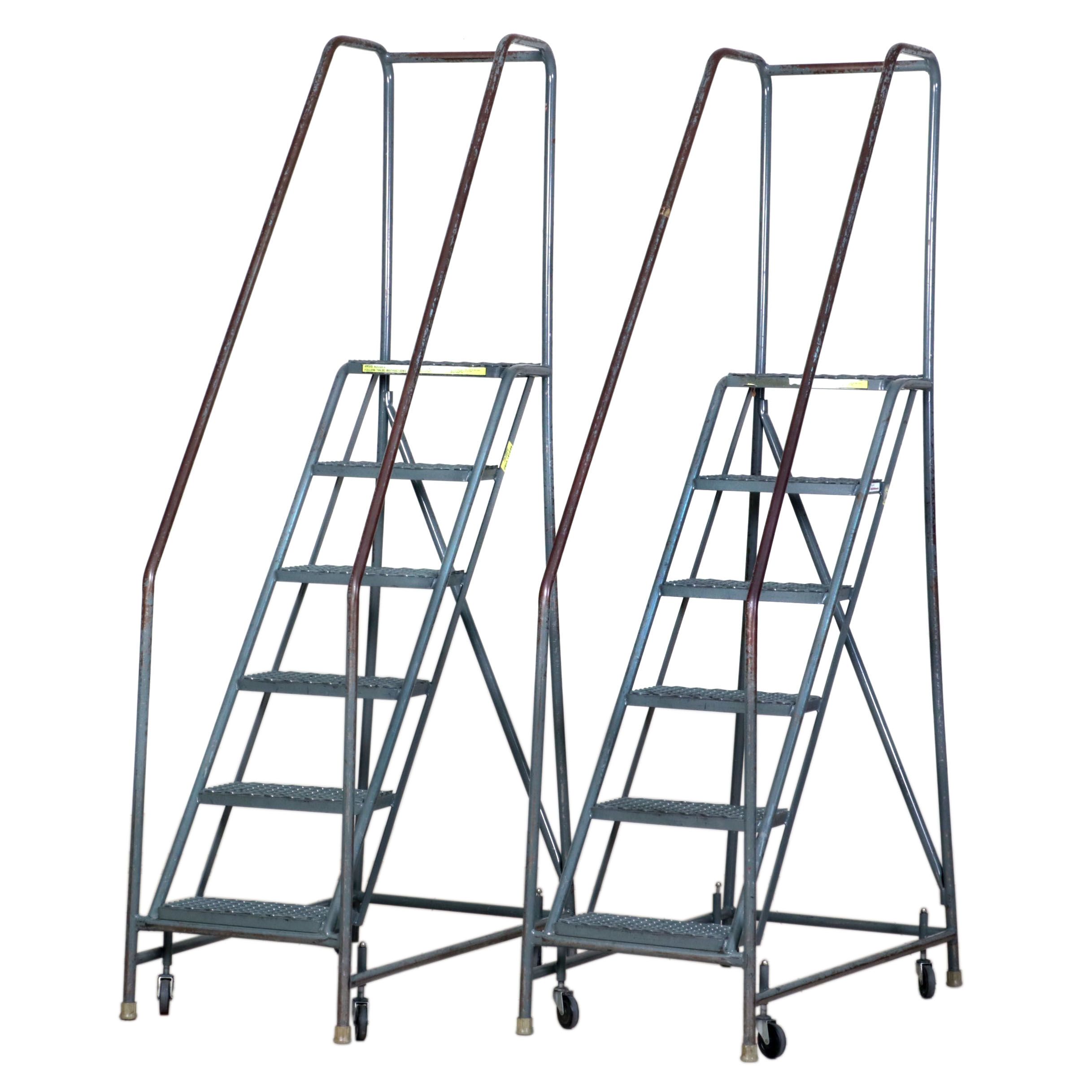 Pair of Tri-Arc Metal Rolling Ladders in Gray Finish | EBTH