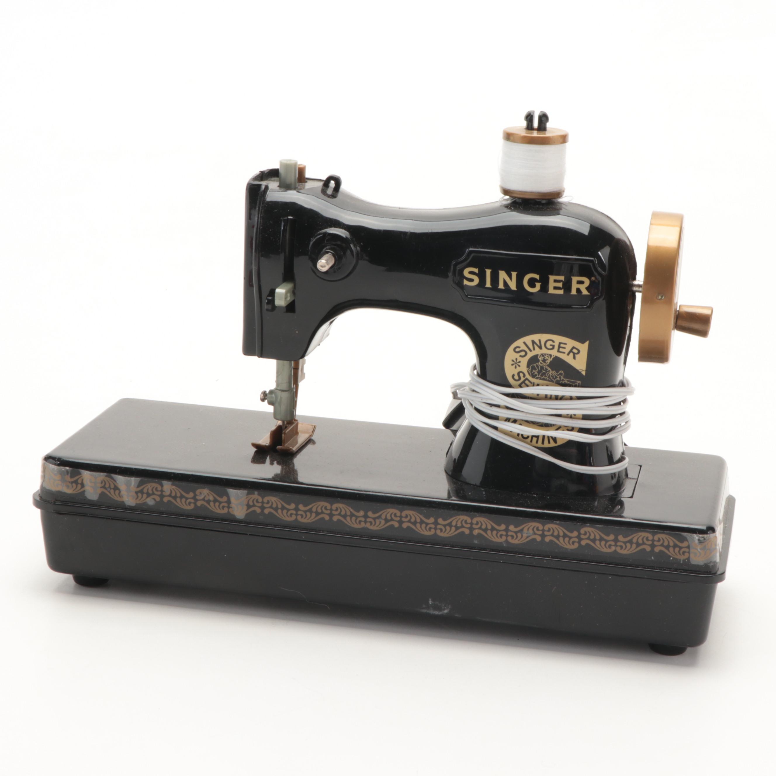 Schylling Play Accordion, M&M's Toy Plane, Singer Toy Sewing Machine ...