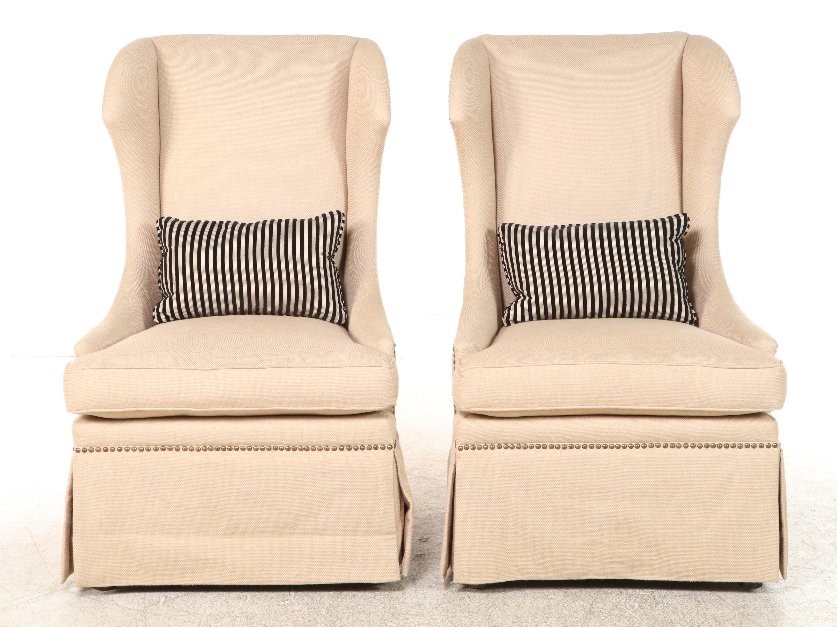 Pair of Caracole Wingback Chairs with Striped Accent Pillows | EBTH