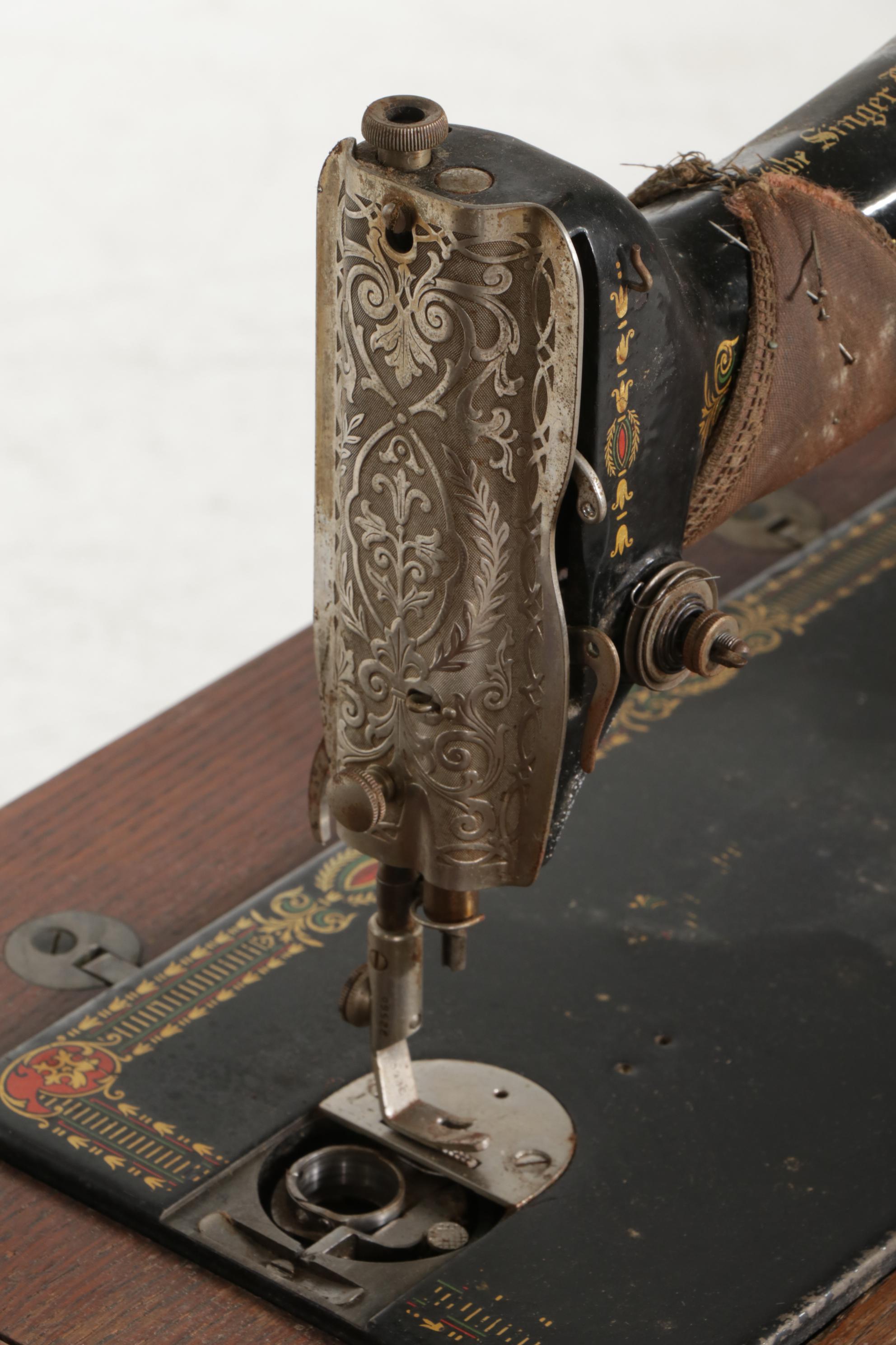 Singer Model 15 Treadle Sewing Machine in Oak and Iron Cabinet | EBTH