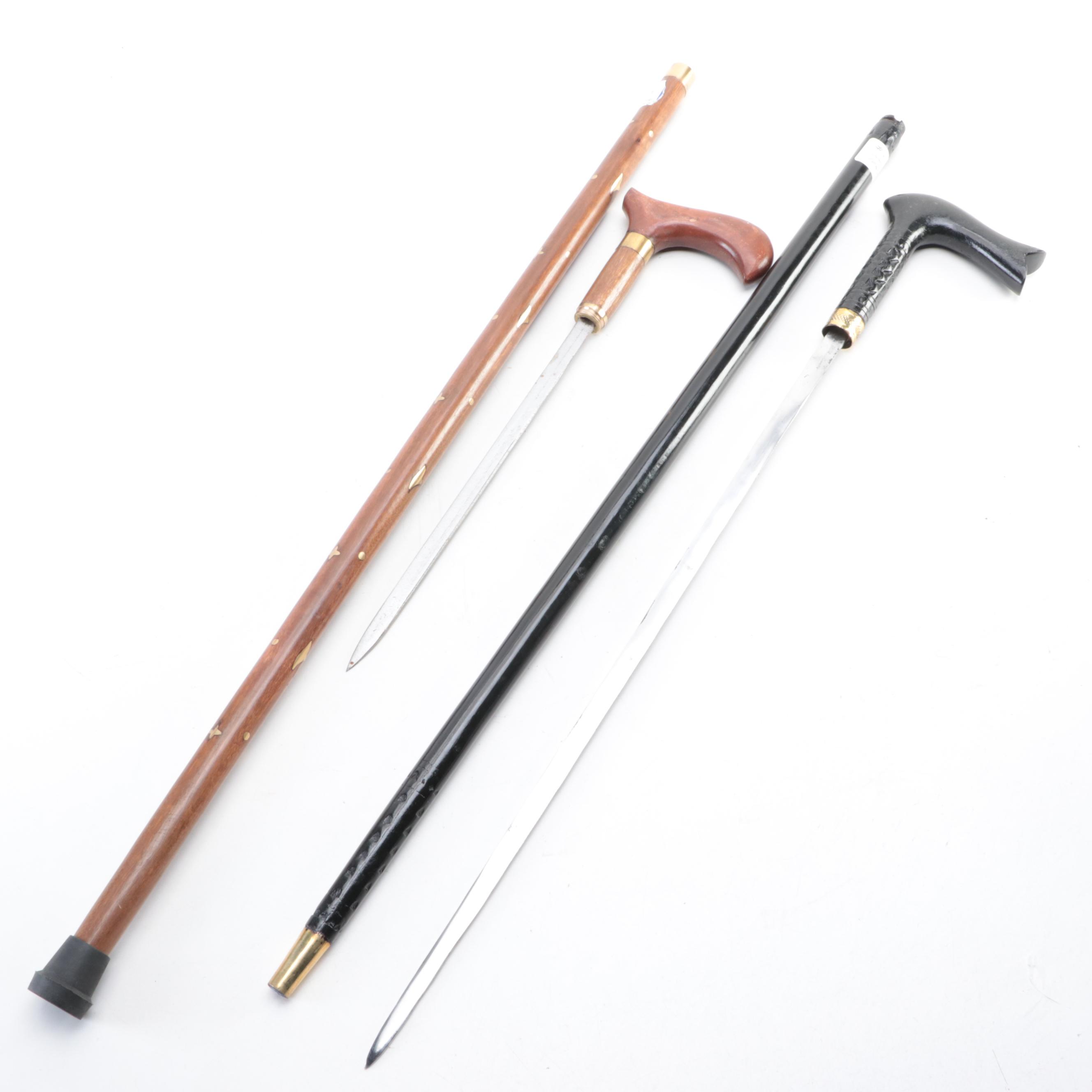 Two Ebonized and Brass Inlaid Sword Canes with Steel Blades | EBTH