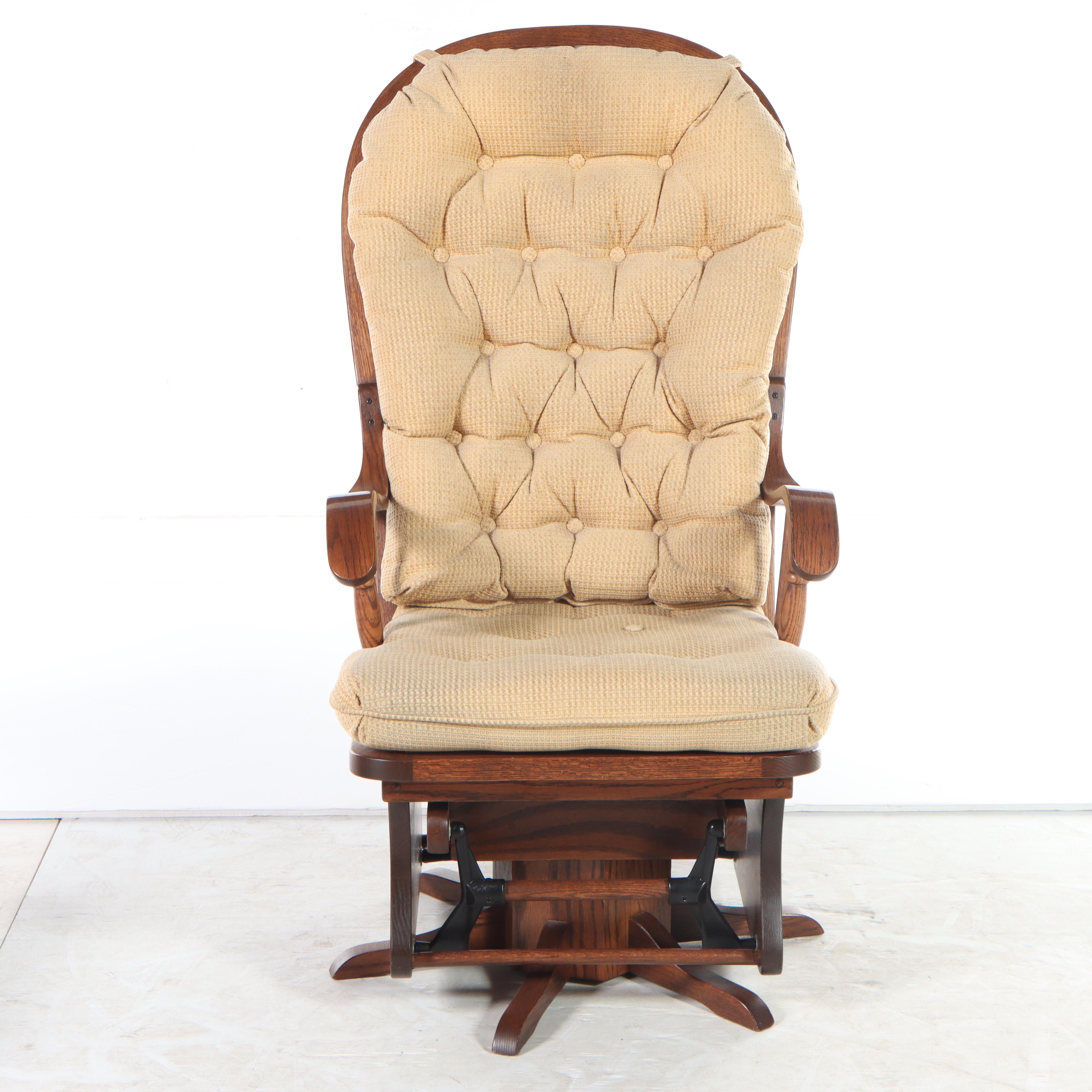 Elite Seating Oak Swivel-Glider with Footstool, Late 20th Century | EBTH