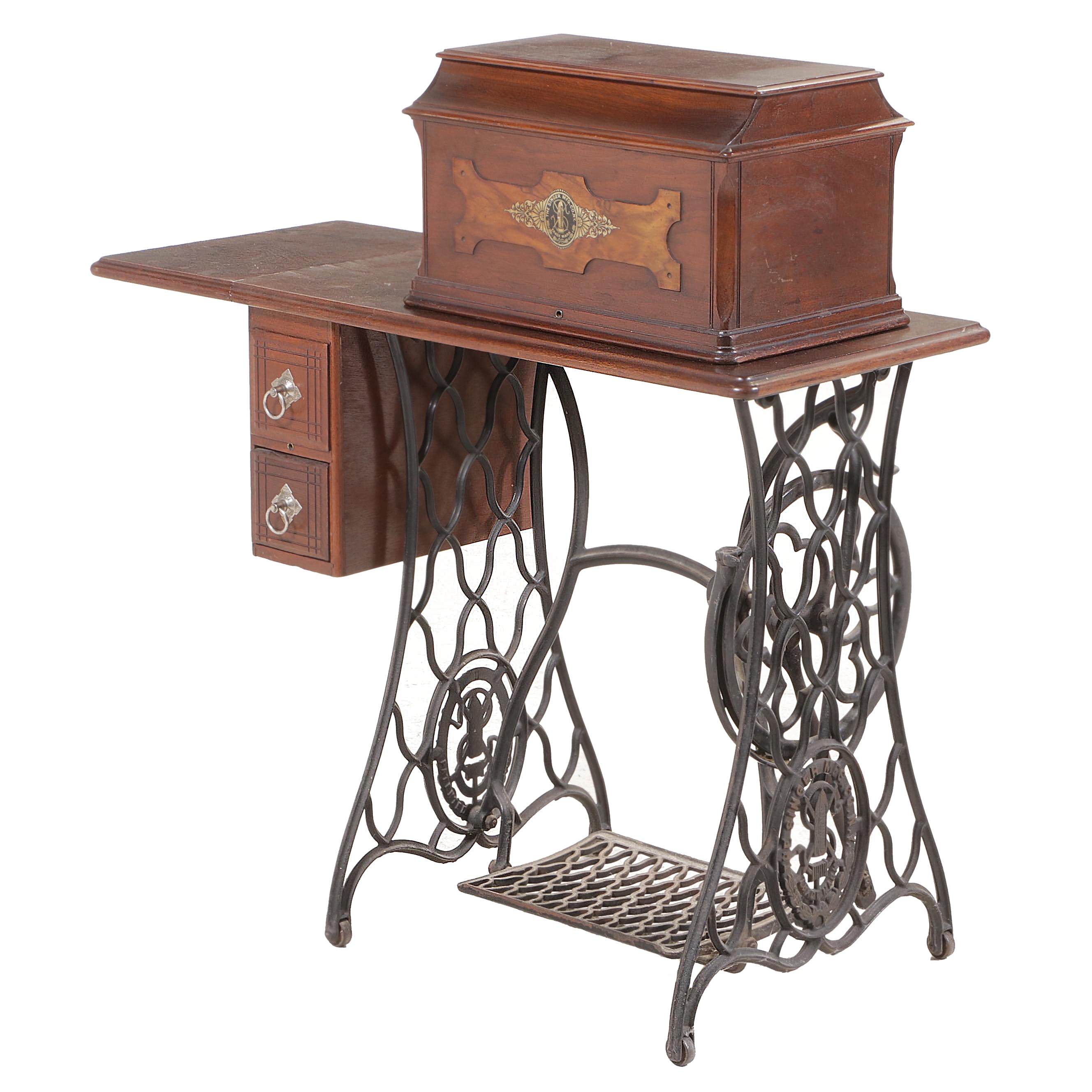 The Singer Mfg. Co. Walnut and Cast Iron Treadle-Base Sewing Machine | EBTH