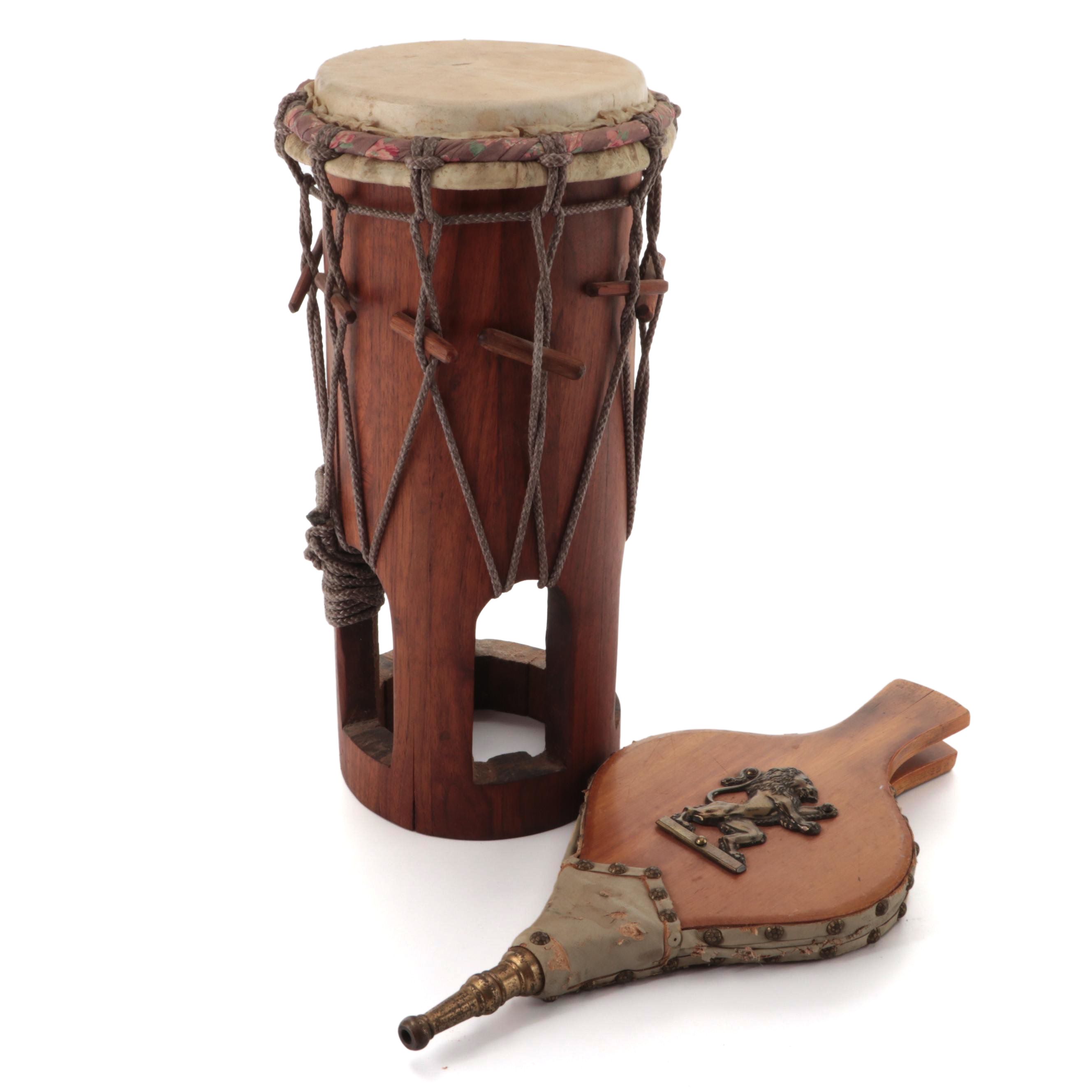 Carved Wood and Hide Drum with Brass Lion Bellows | EBTH