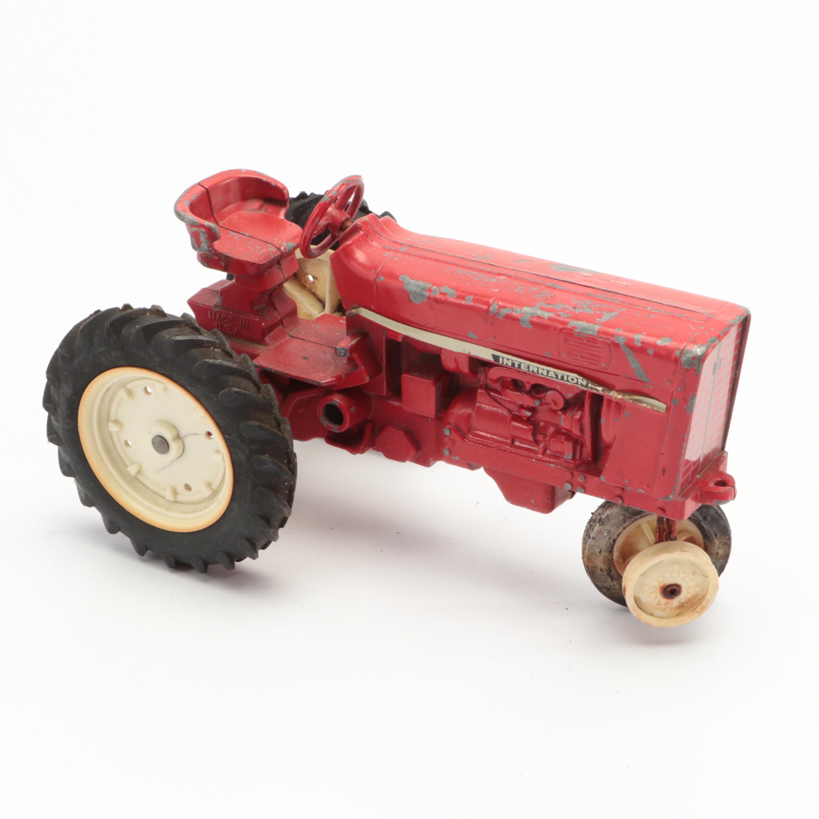 Ertl Diecast Metal Tractors and Plow with Rolled Steel Cannon | EBTH